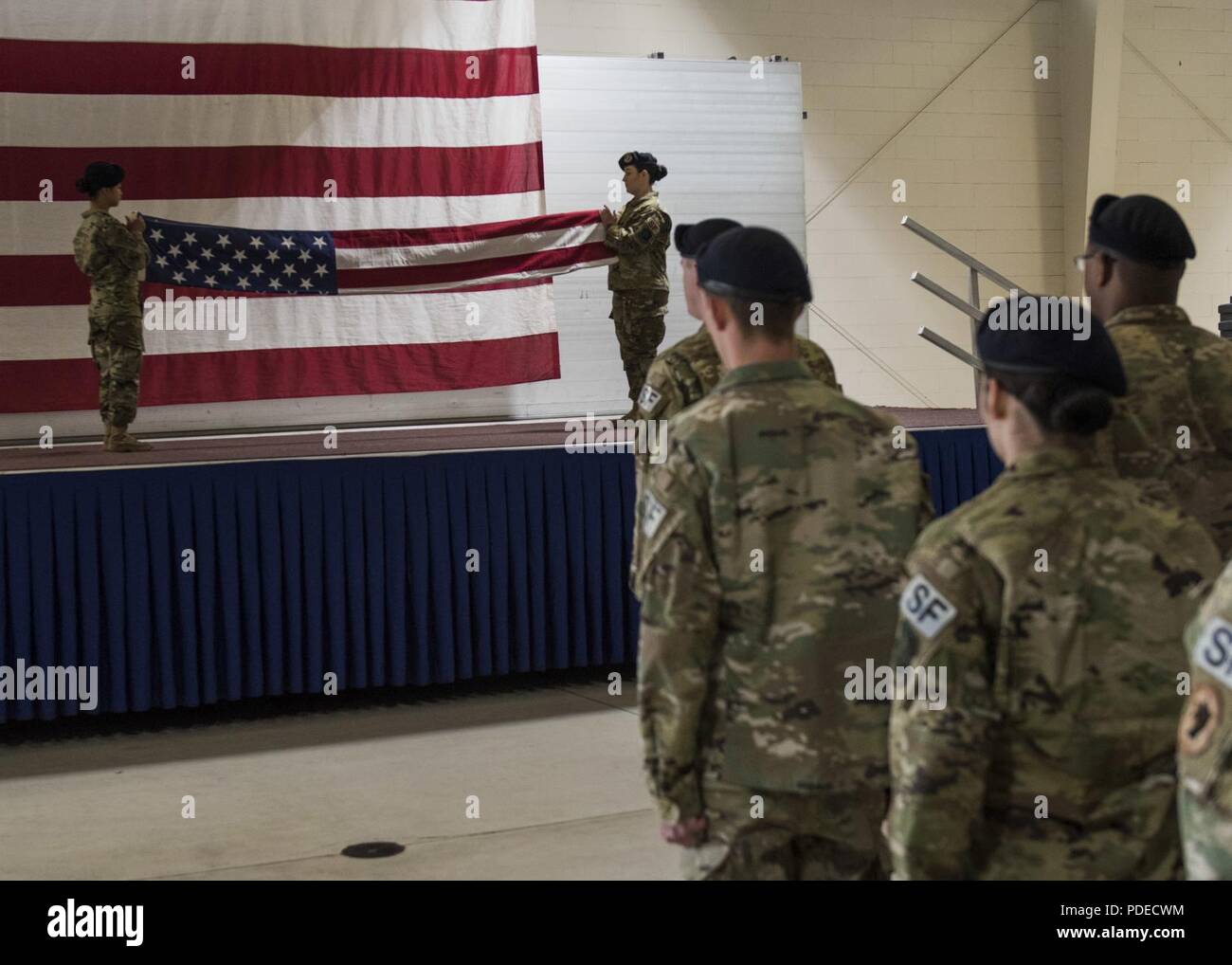Team Minot security forces Airmen fold a flag during the Police Week ...