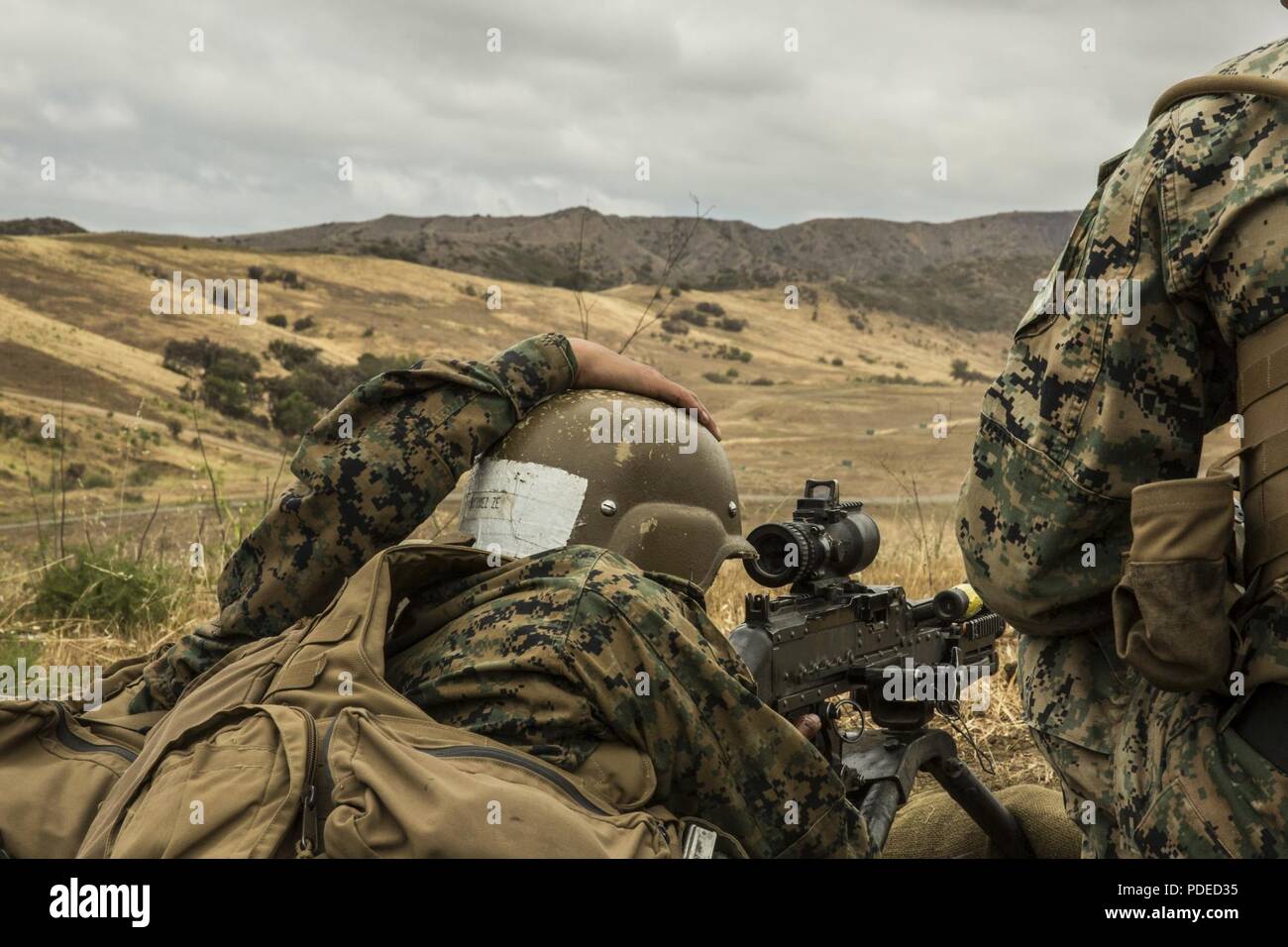 U.S. Marines attending Marine Combat Training (MCT) fire an M240B ...