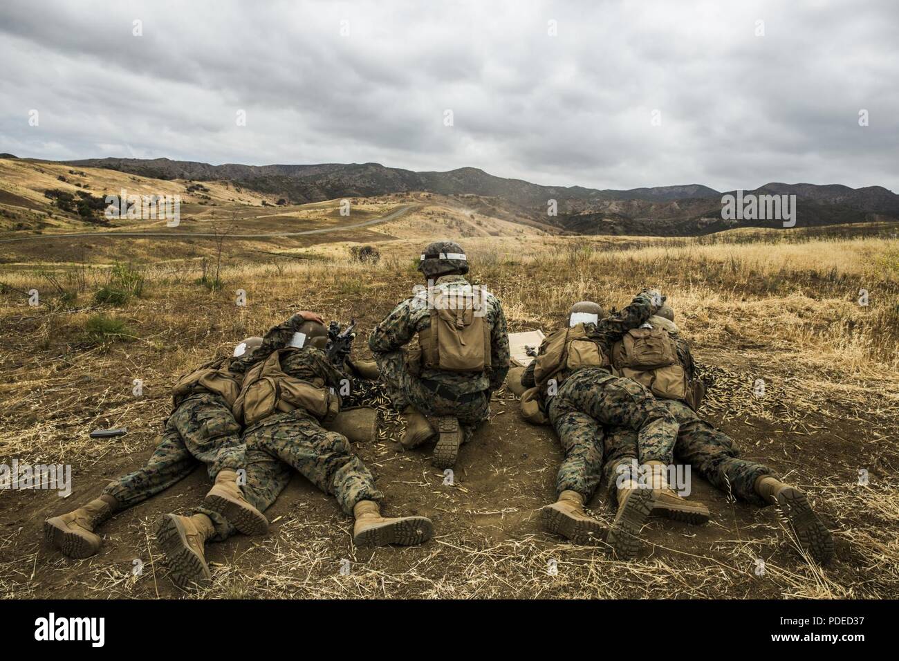U.S. Marines attending Marine Combat Training (MCT) fire an M240B ...