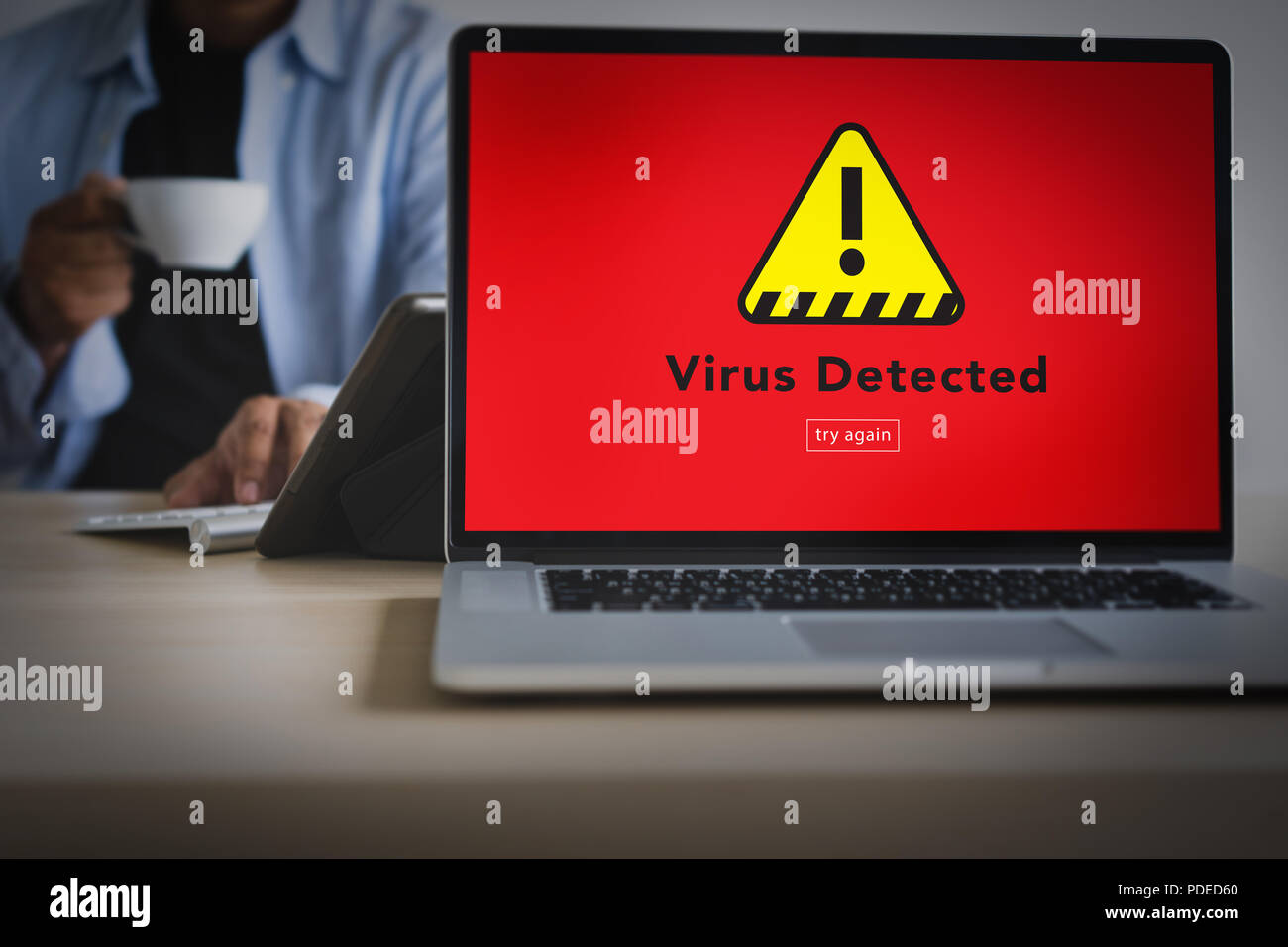 Hacker Protection Concept Man working on laptop Virus Detected Alert ...