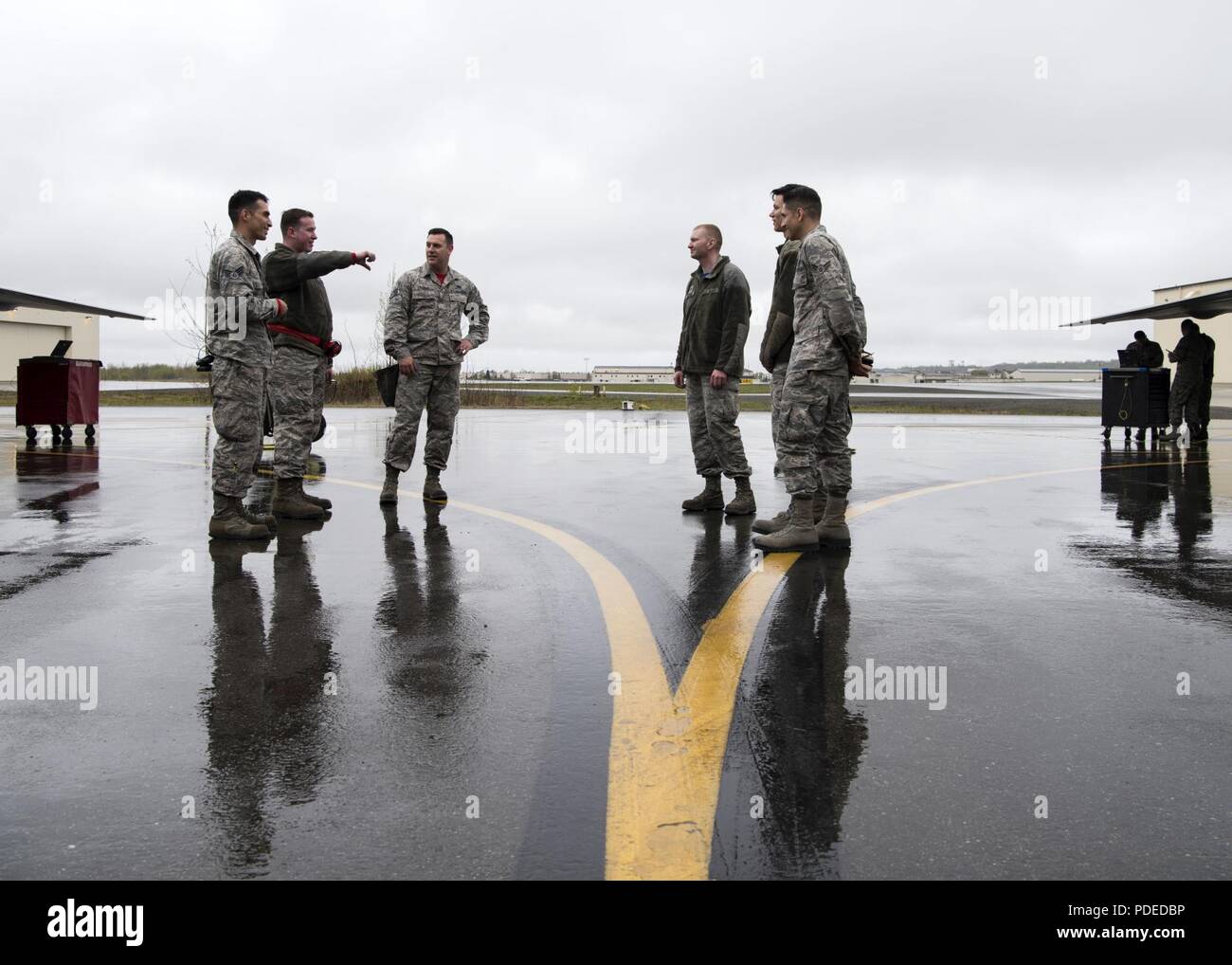 The 90th and 525th aircraft maintenance unit load crew teams stand ...