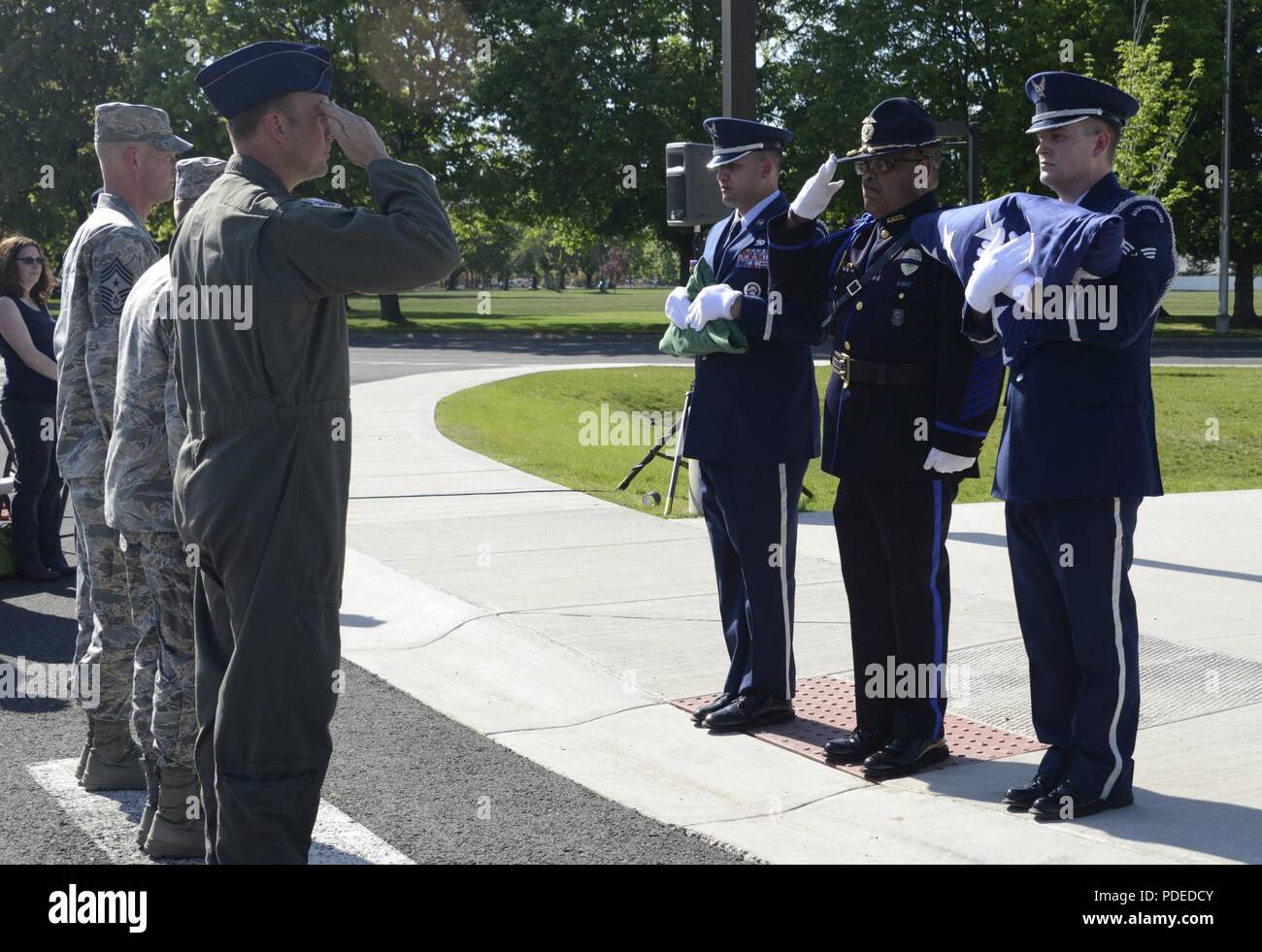 Col. Johan Deutscher, 141st Air Refueling Wing commander, renders a ...
