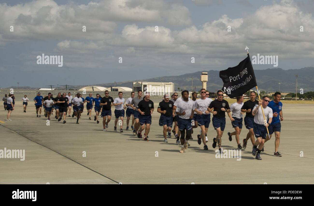 Airmen from 515th Air Mobility Operations Wing run in formation during ...