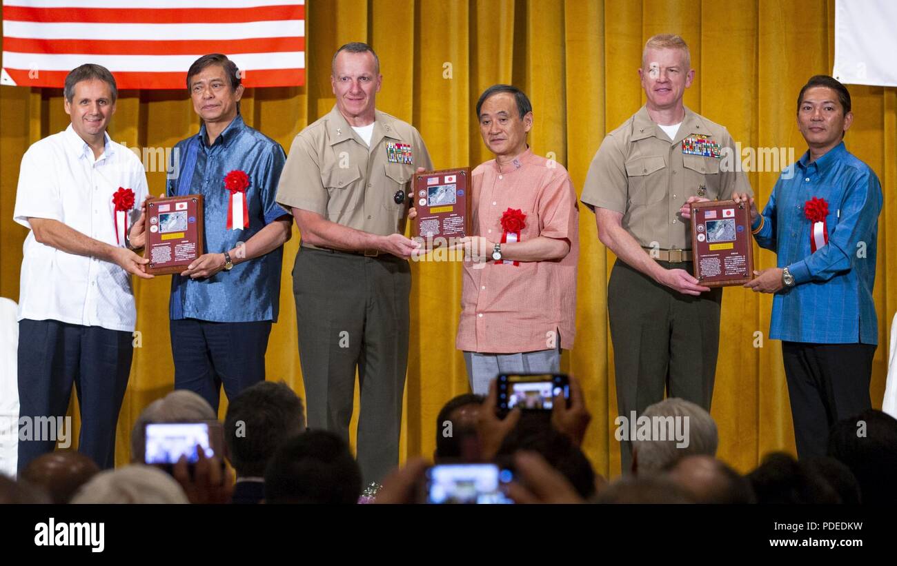 NAHA, OKINAWA, Japan - From left to right, Joel Ehrendreich, Kiichiro ...