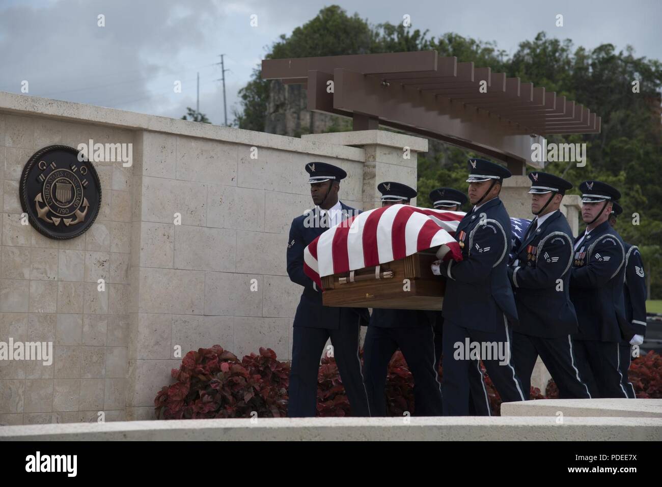 Airmen assigned to the U.S. Air Force Honor Guard transport the casket ...