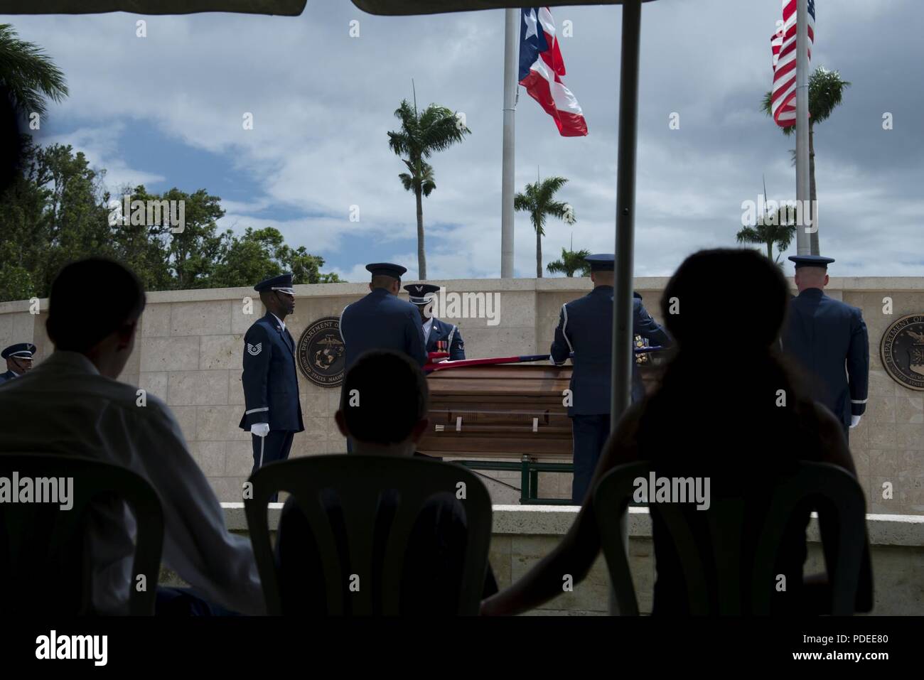 Airmen assigned to the U.S. Air Force Honor Guard fold an American flag ...