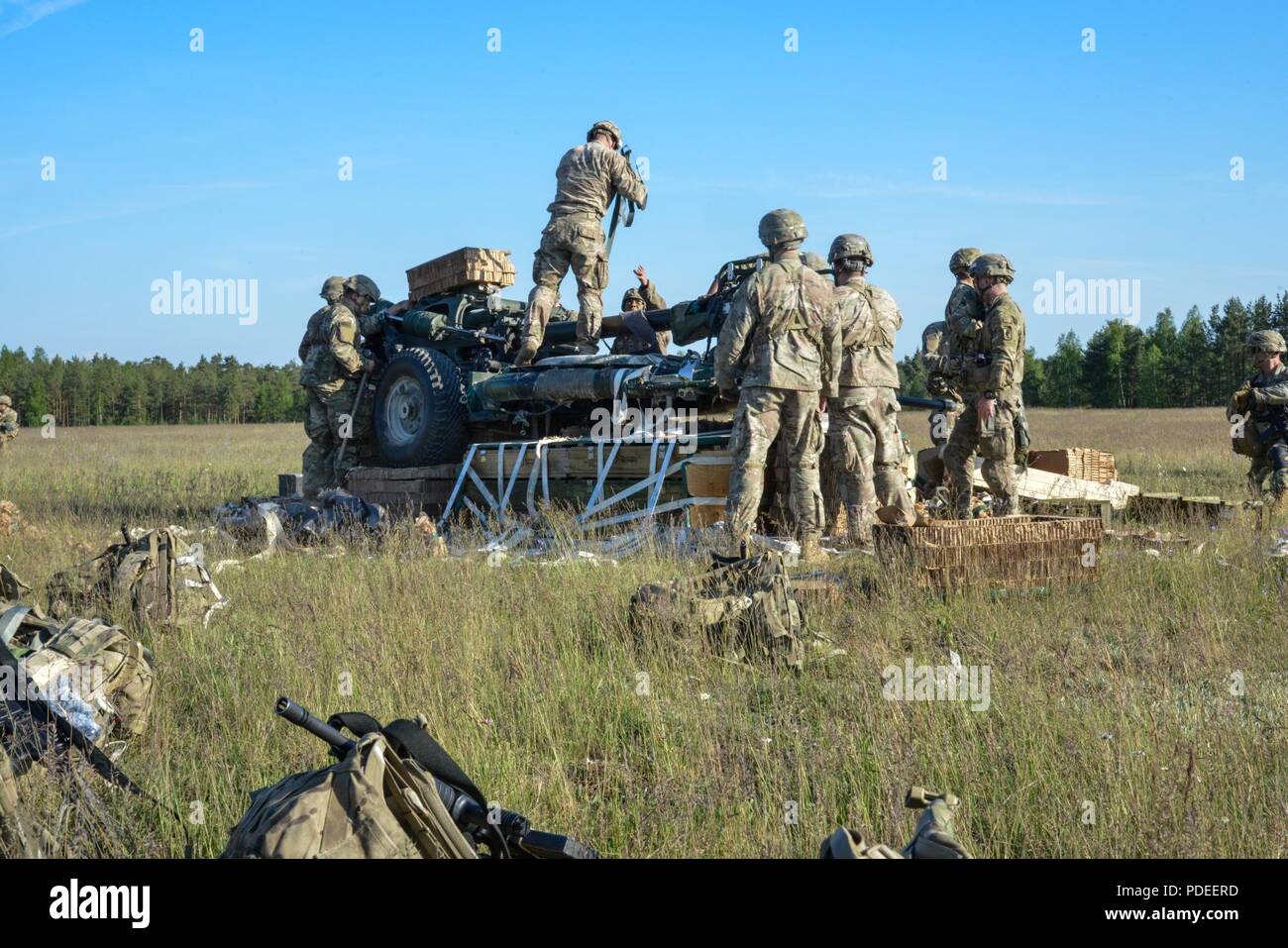 U.S. Army Paratroopers assigned to 4th Battalion, 319th Airborne Field Artillery Regiment, 173rd ...