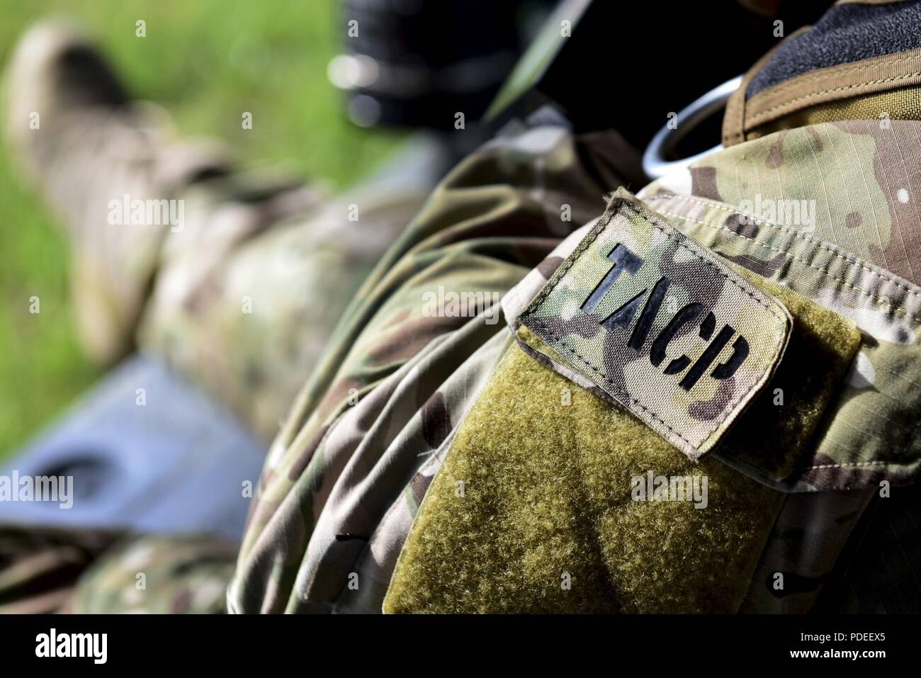 U.S. Air Force tactical air control party members ride in a Missouri ...