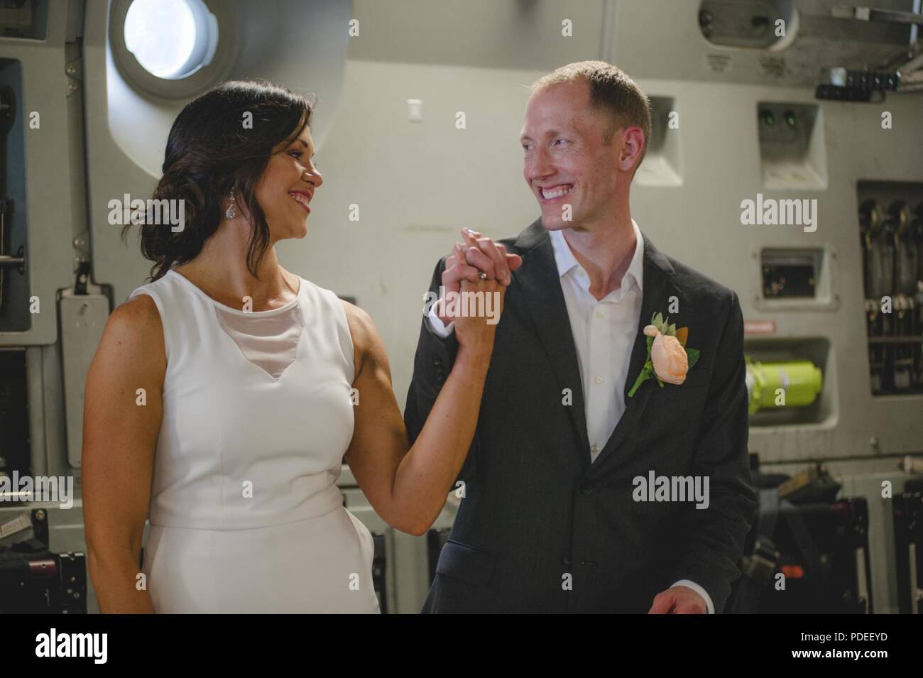 Capts. Amanda (left) and Derek Martindale raise their hands after being ...