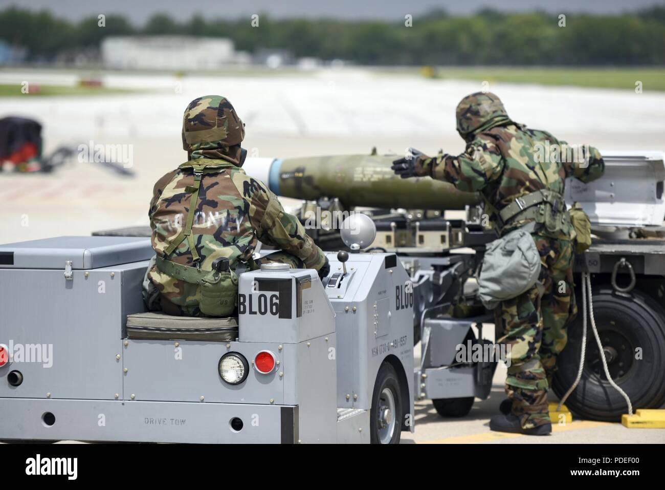 with the 180th Fighter Wing maintenance group use a bomb lift to remove ...