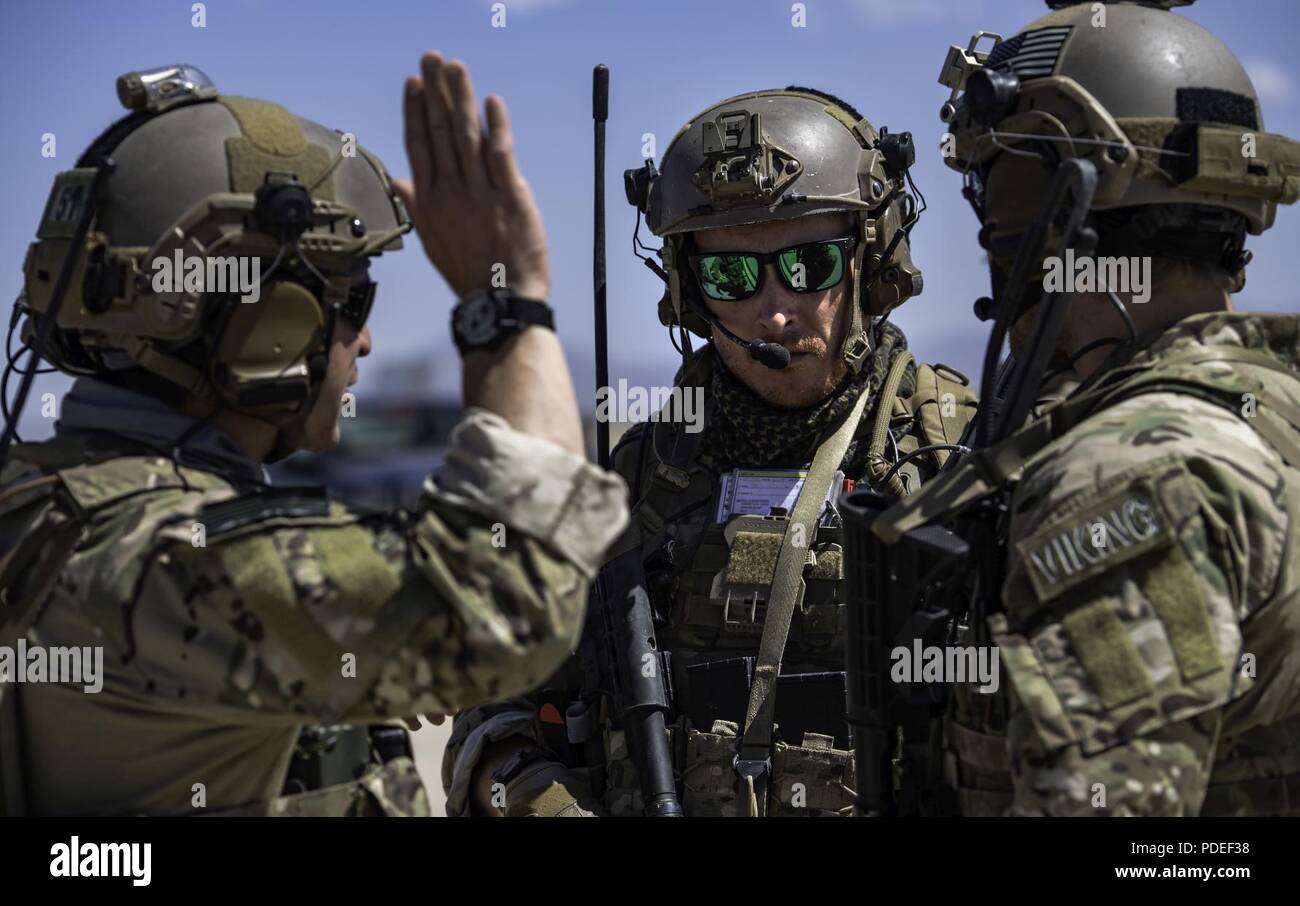 U.S. Air Force pararescue jumpers establish a plan for conducting a ...