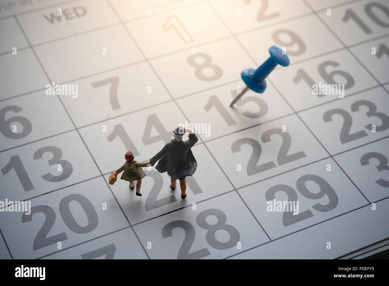 Parent and kid going to school with pinned calendar Stock Photo - Alamy