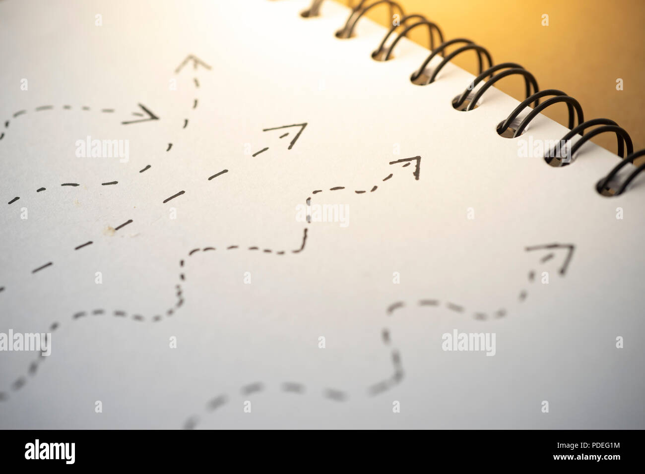 Different arrow path draw on white paper Stock Photo - Alamy