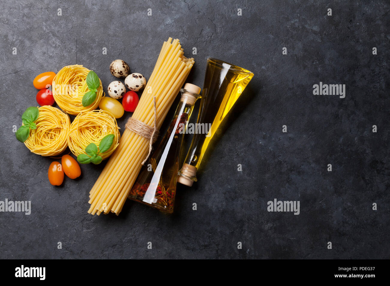 Various pasta and condiments. Cooking concept. Top view with space for ...
