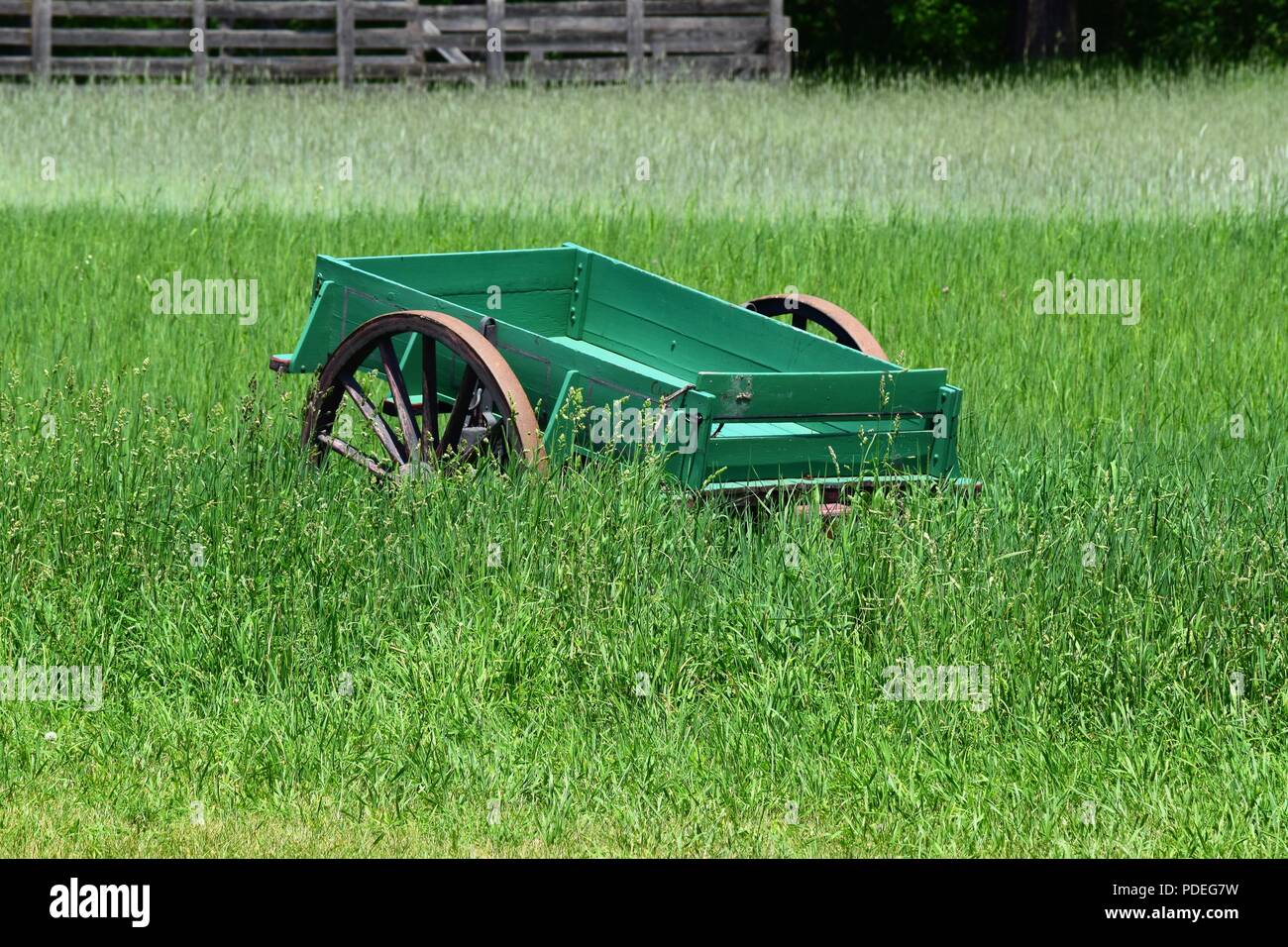 Barrel in a cart with big wheels Stock Photo - Alamy