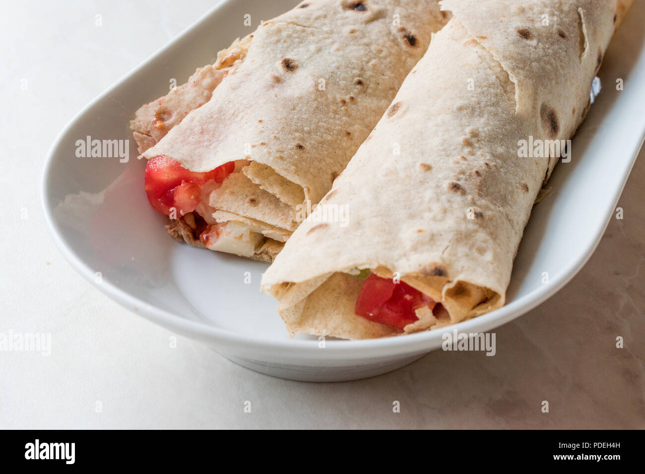 Turkish Fast Food Wrap Gozleme with Tomatoes and Cheese. Traditional ...