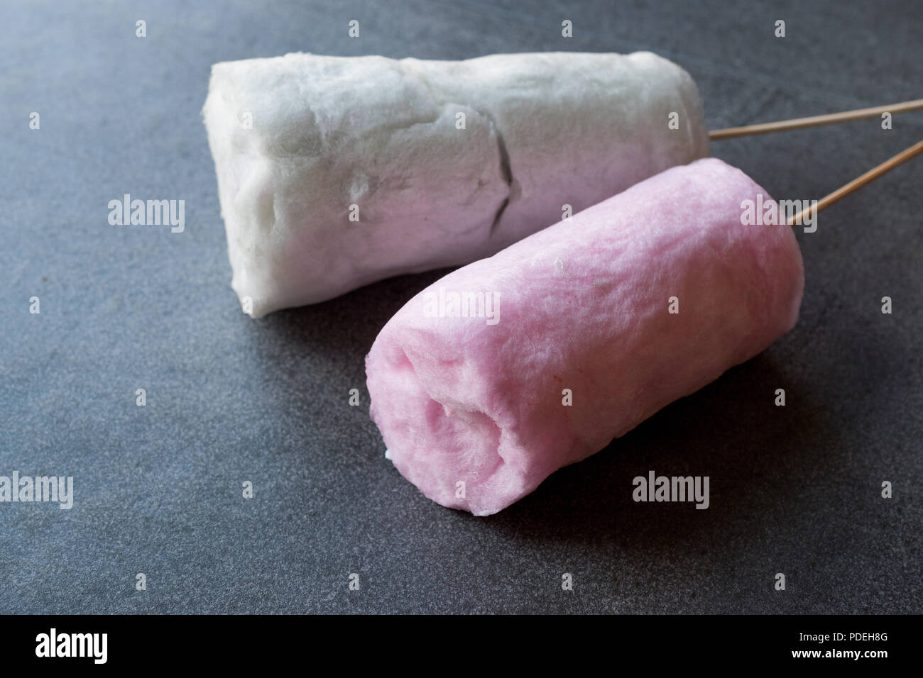 Cylinder Shape Cotton Candy with Wooden Stick on Grey Surface ...