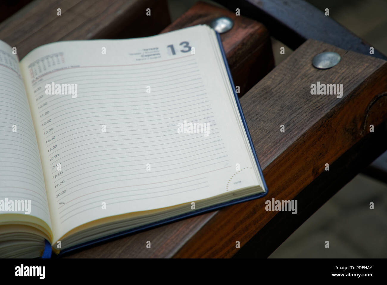 Open Notebook lies bench in park, business concept Stock Photo - Alamy