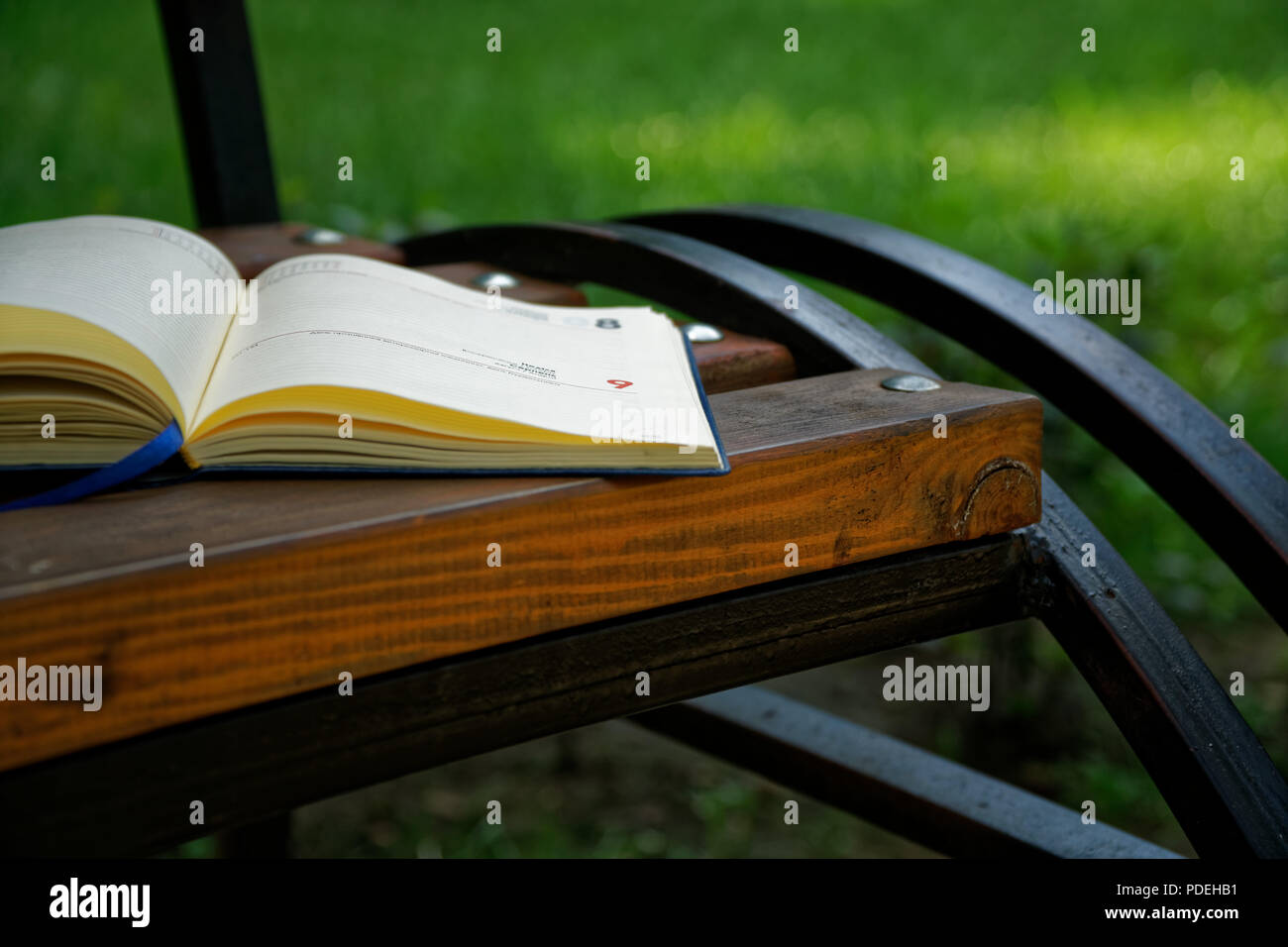 Open notebook lies bench hi-res stock photography and images - Alamy
