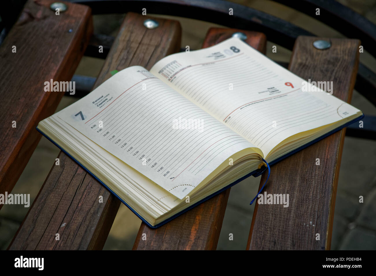 Open Notebook lies bench in park, business concept Stock Photo - Alamy