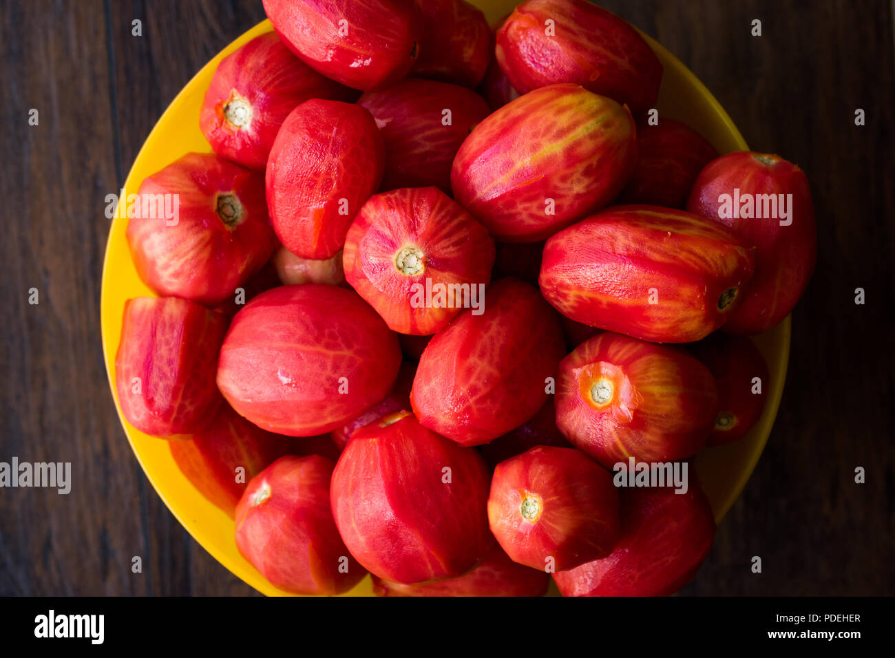 Whole Peeled Tomatoes in Yellow Bowl. Organic Food Stock Photo - Alamy
