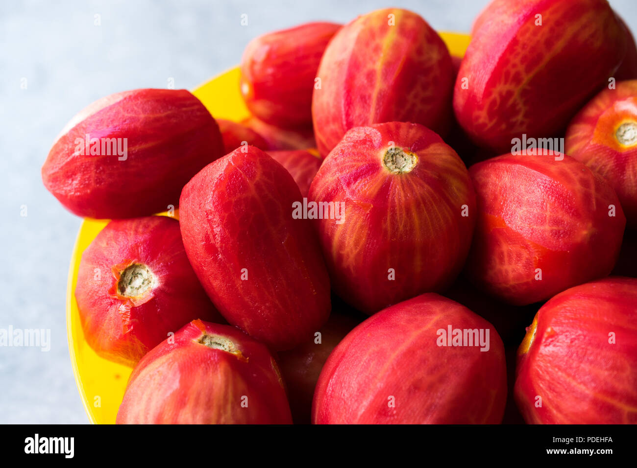 Whole Peeled Tomatoes in Yellow Bowl. Organic Food Stock Photo - Alamy