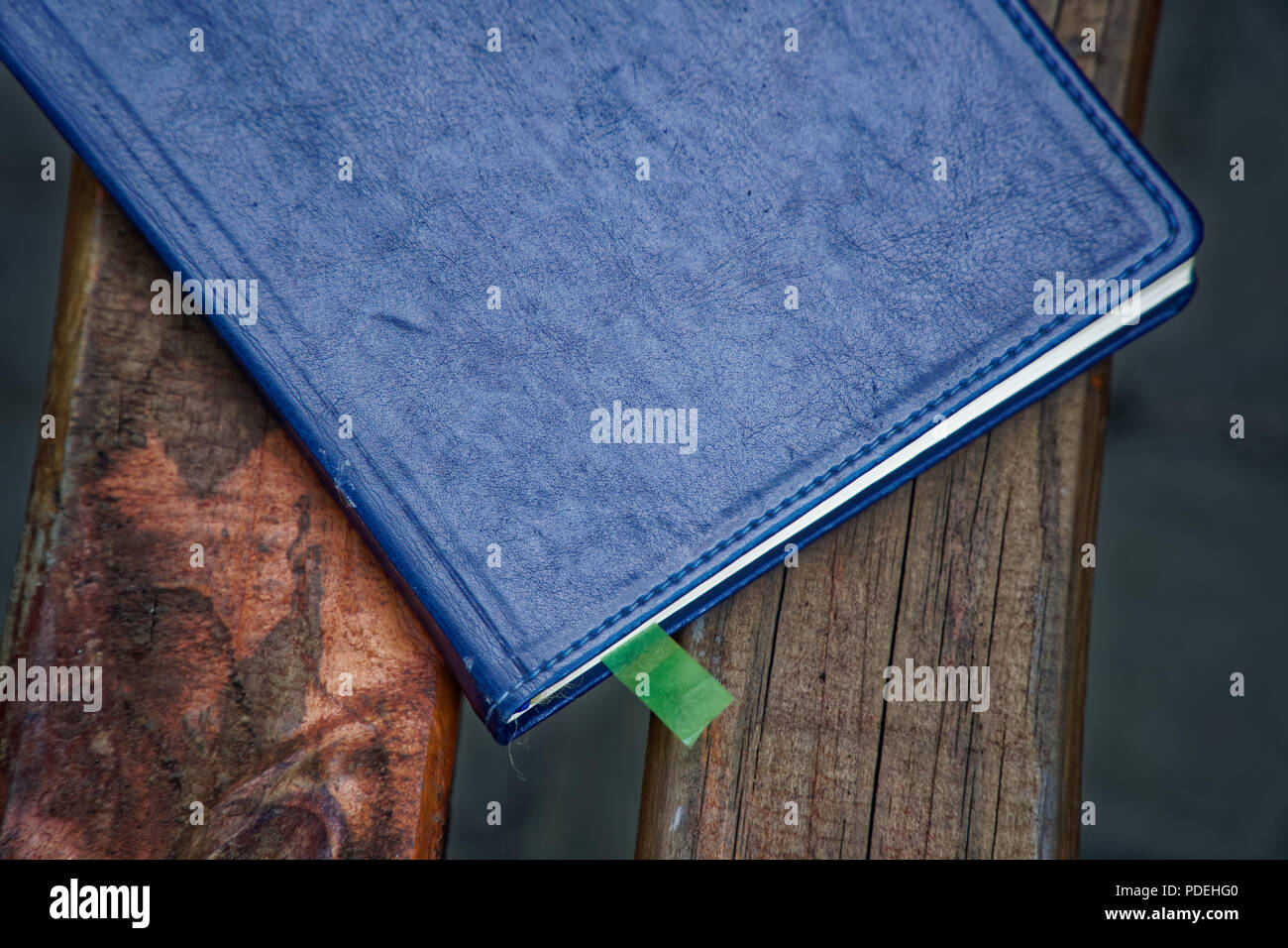 Notebook on bench in park, business concept Stock Photo - Alamy