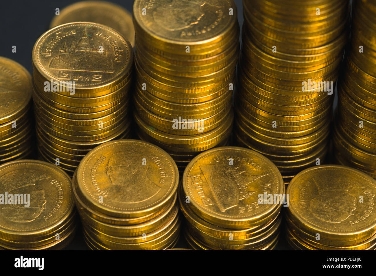 Savings, increasing columns of coins, piles of coins arranged as a ...