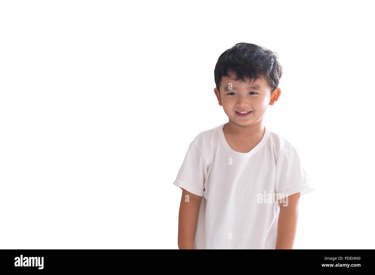 Asian kid boy in white t-shirt standing and smiling, isolated on white ...