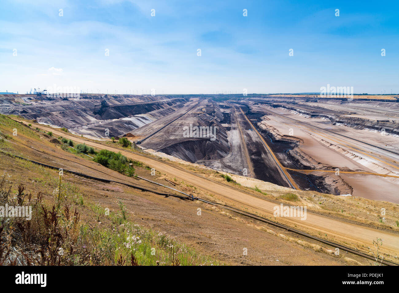 enormous bucket-wheel excavator in an open pit lignite brown-coal mine ...