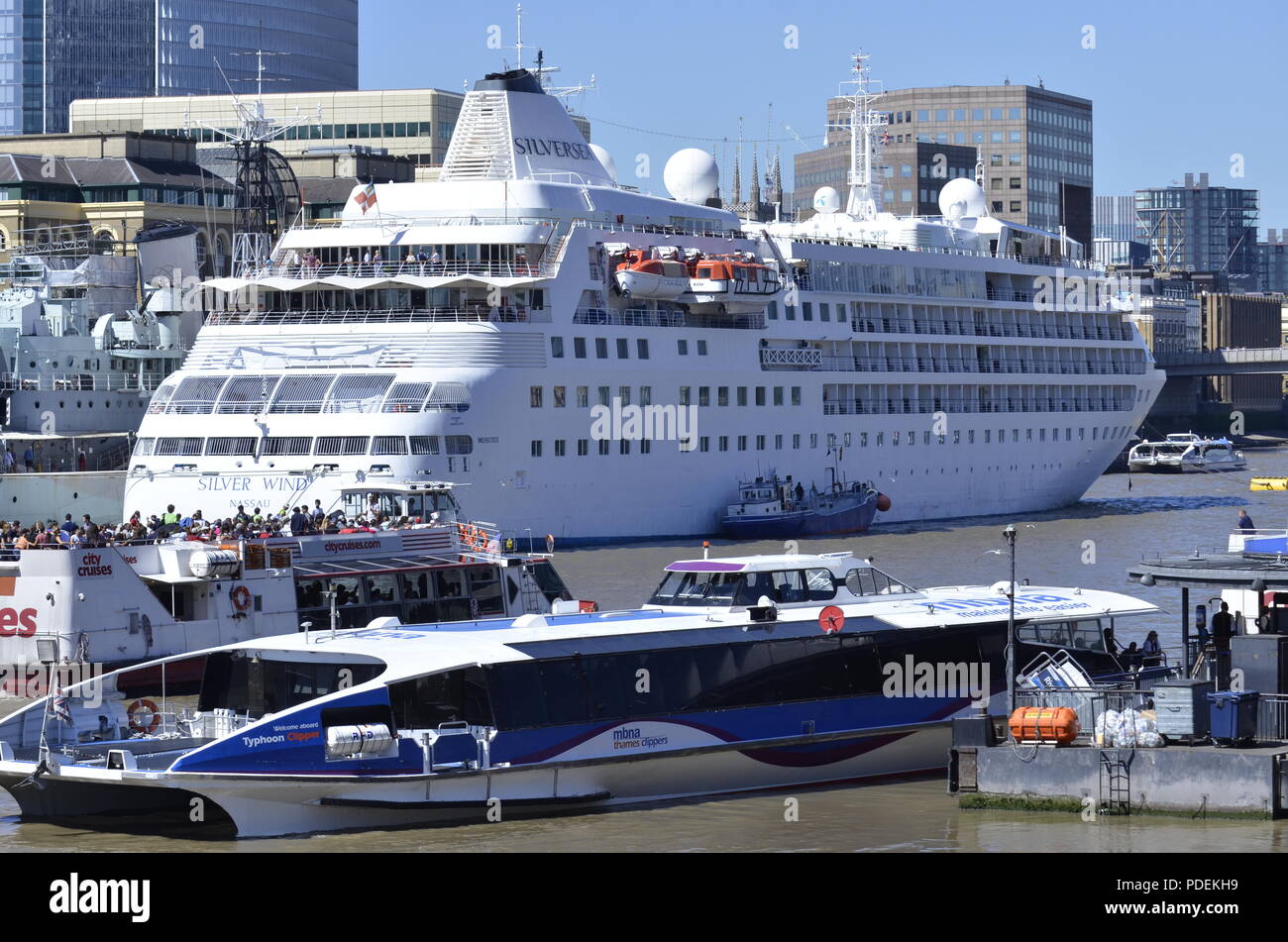 The Silver Wind luxury cruise liner moored alongside HMS Belfast on the ...