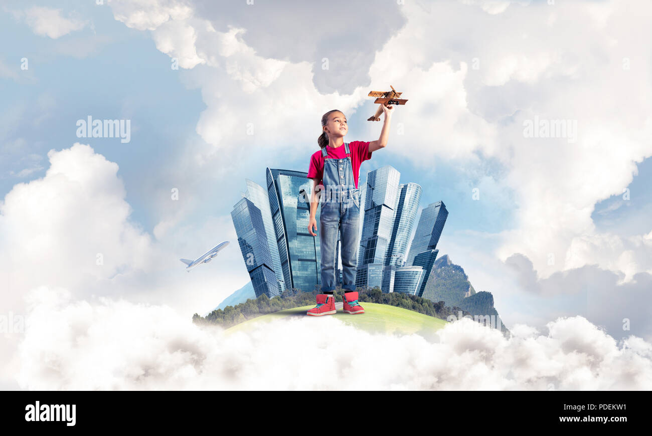 Concept of careless happy childhood with girl dreaming to become Stock ...