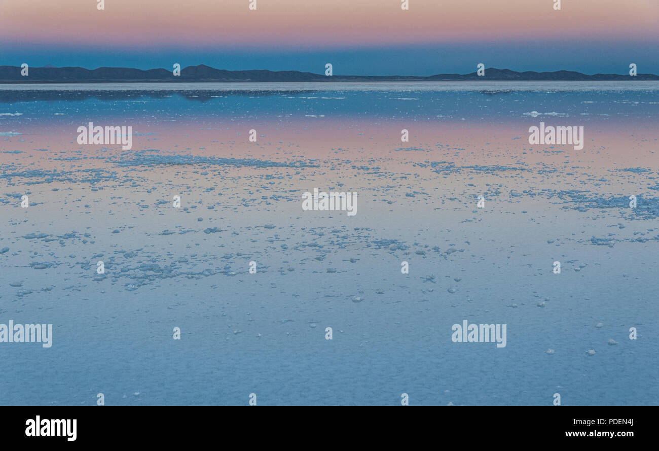 Sunset in the Salar de Uyuni, near Colchani. It is the largest salt ...
