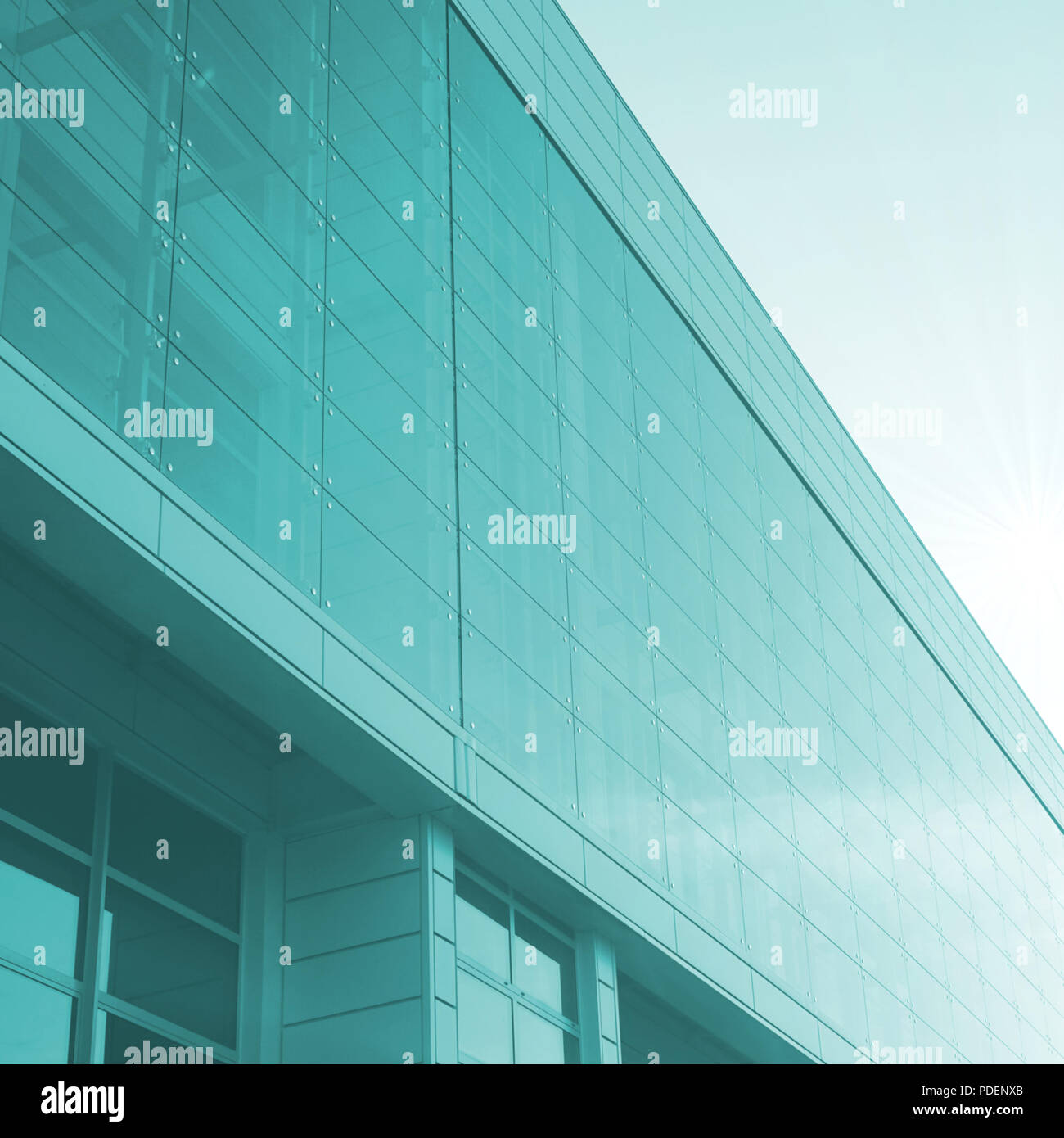 Turquoise abstract exterior view of a glass wall in a modern building ...