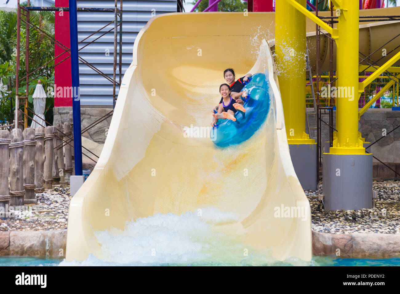 PHUKET, THAILAND - 8 JULY 2017 - Asian female teenagers slide down ...