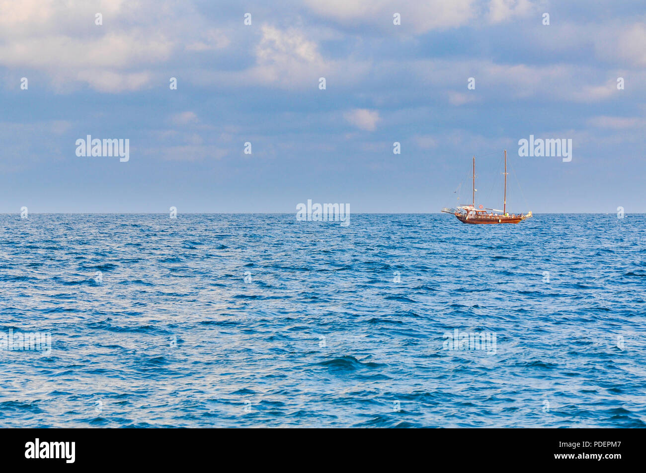 Ship on the sea, ocean with blue sky and clouds Stock Photo - Alamy