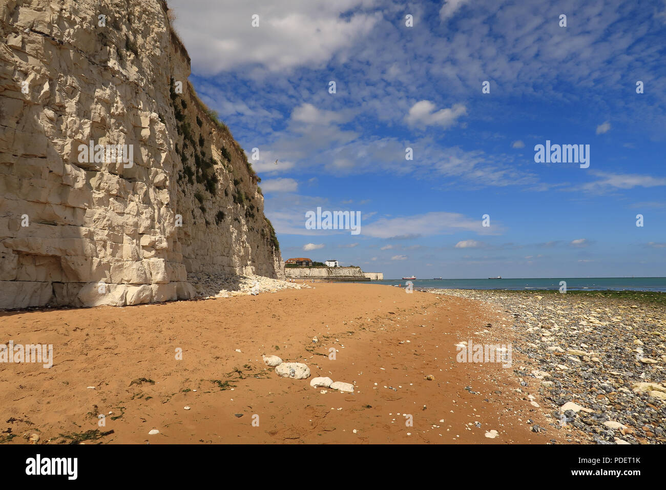 A view of the sandy beach and cliffs at Joss Bay in Kent Stock Photo ...