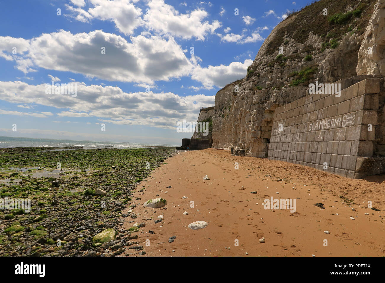 A view of the sandy beach and cliffs at Joss Bay in Kent Stock Photo ...