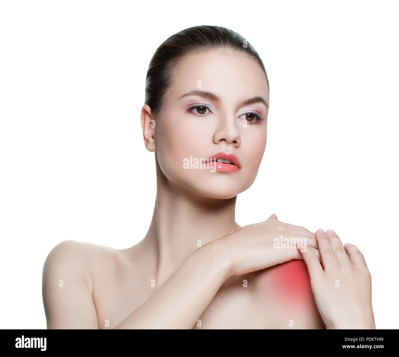 Woman with sore shoulder isolated on white background Stock Photo - Alamy