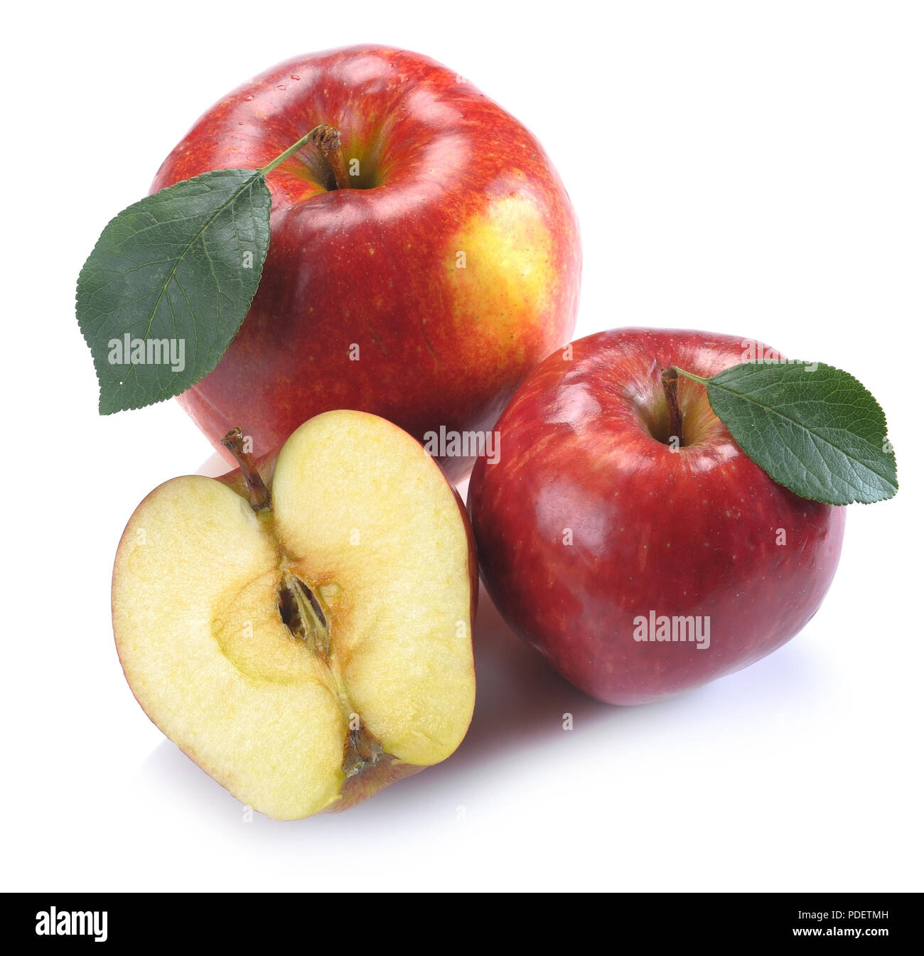 two and a half red apples with leaves Stock Photo - Alamy