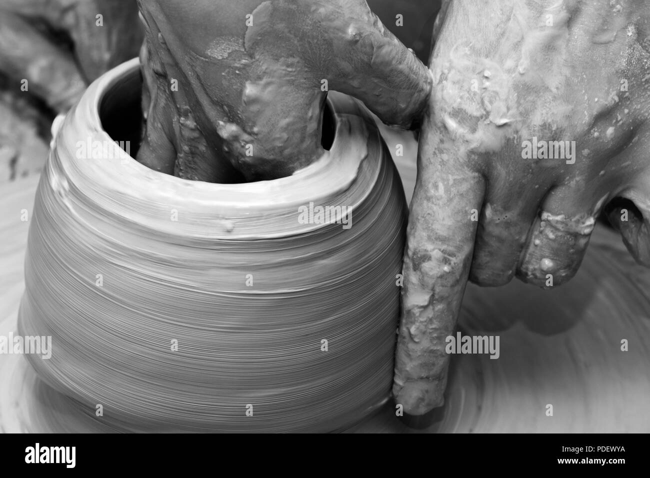 Process of making clayware on potter's wheel. Potter at work. Close-up ...
