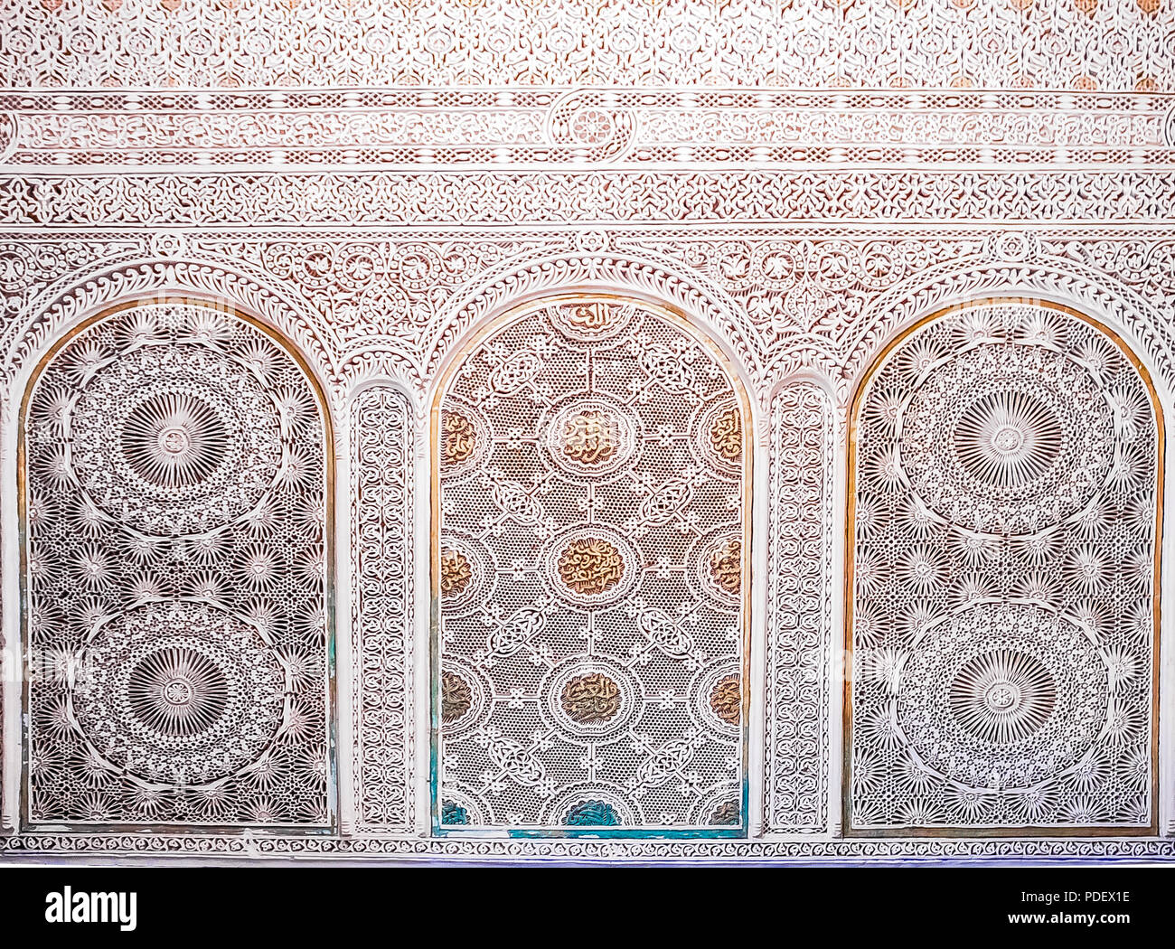 Ornate arabesque wall carvings in a Moroccan riad Stock Photo - Alamy