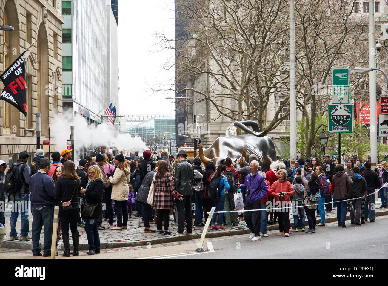 group of Tourist taking photographs with the Charging Bull Wall Street ...