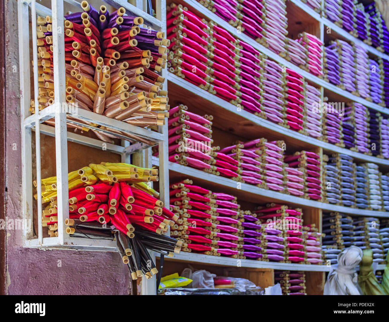 Colorful Moroccan silk thread bobbins on display in a shop in the souk ...