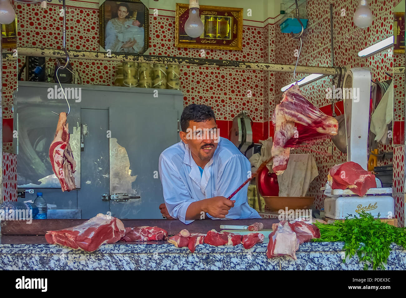 Fez, Morocco - May, 11, 2013: Butcher in an open air Moroccan market ...