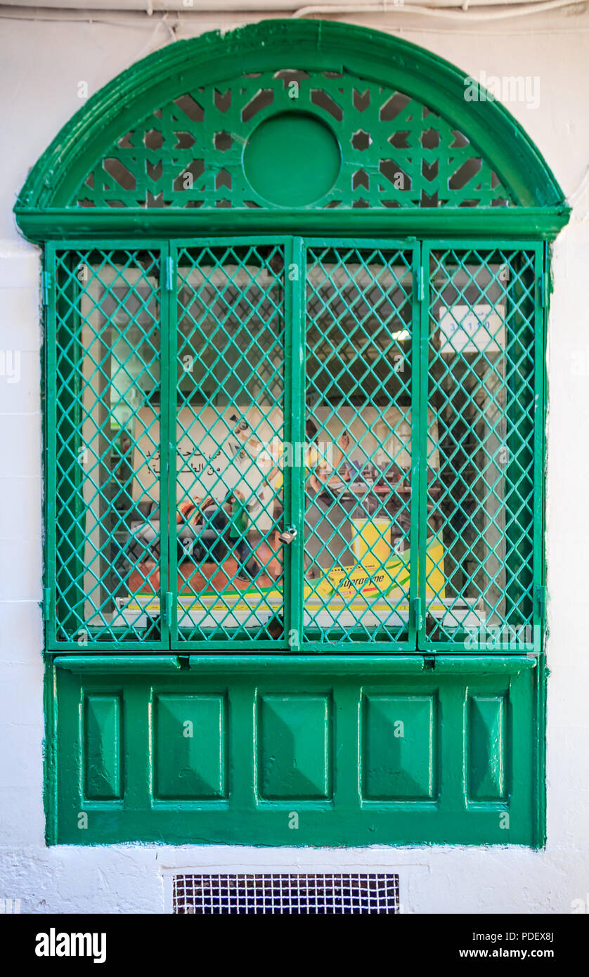 Old wooden intricately carved window in a traditional Moroccan house in ...