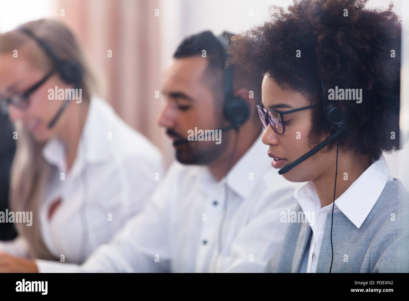 Portrait Of A Smiling African Female Customer Service Executive Stock ...