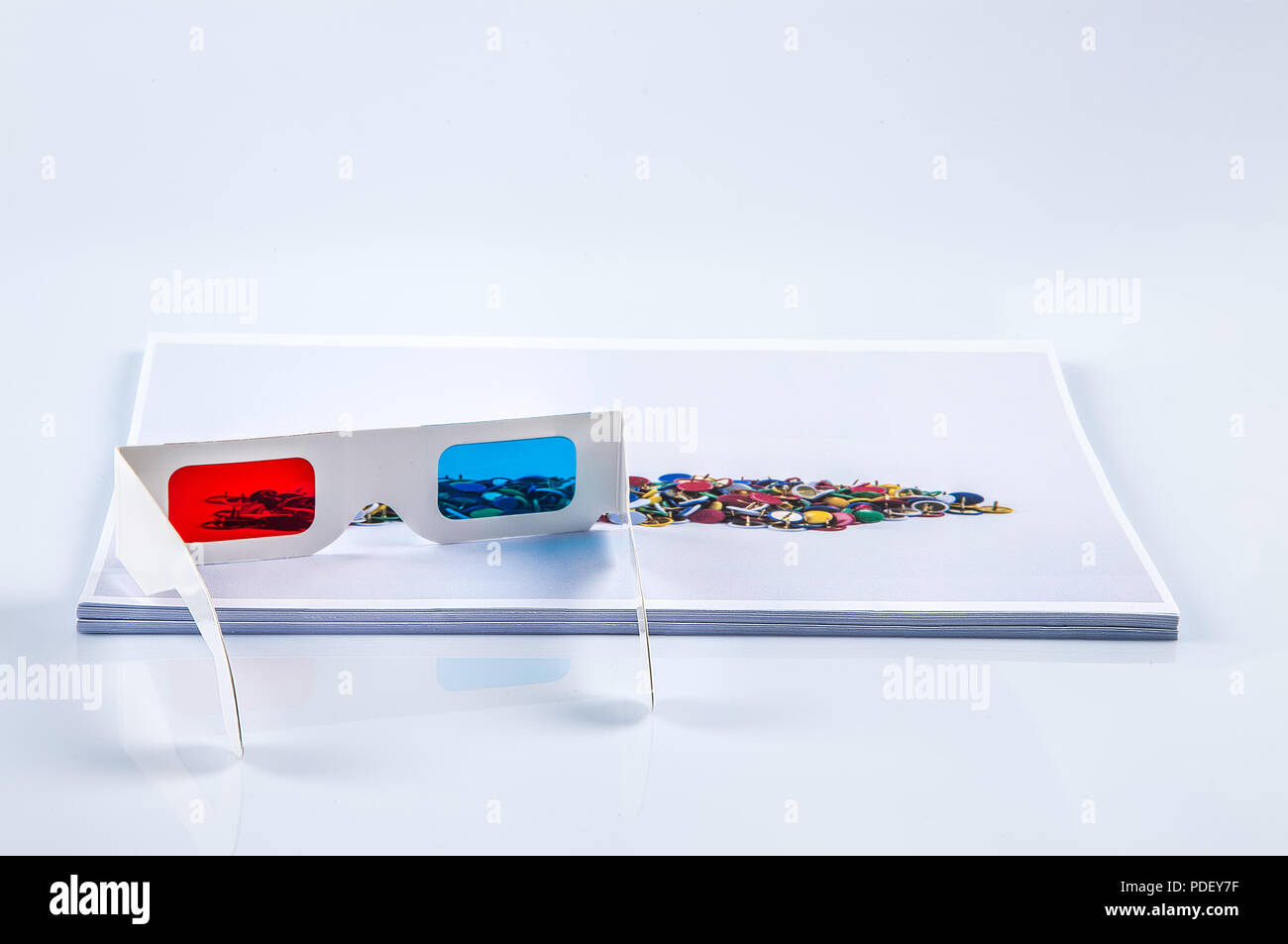 3D Glasses on print of colorful pins Isolated on white background Stock ...