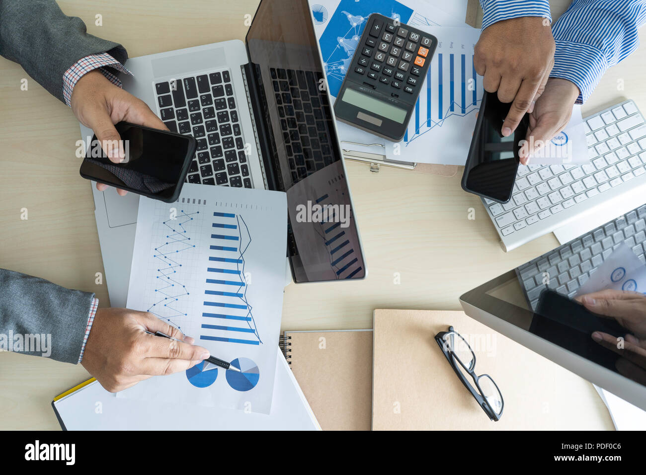 teamwork reports accounting concept analyzing financial Stock Photo - Alamy