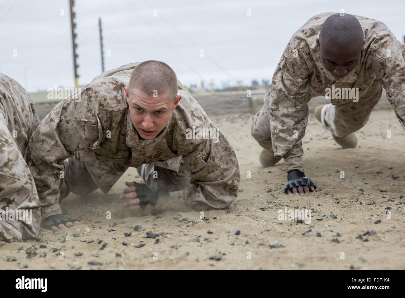Recruits with Kilo Company, 3rd Recruit Training Battalion, crawl ...